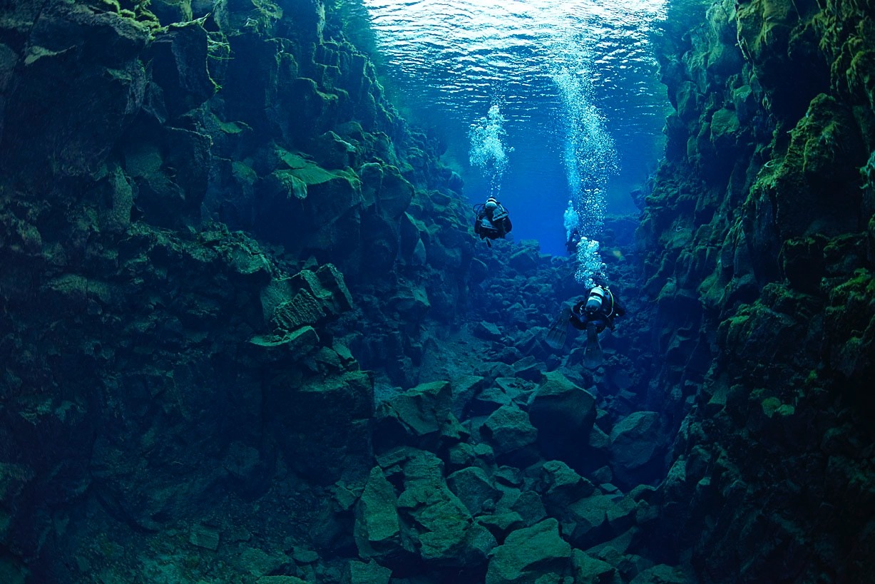 Diving Silfra under the Midnight Sun Day Tour - DIVE.IS - Iceland
